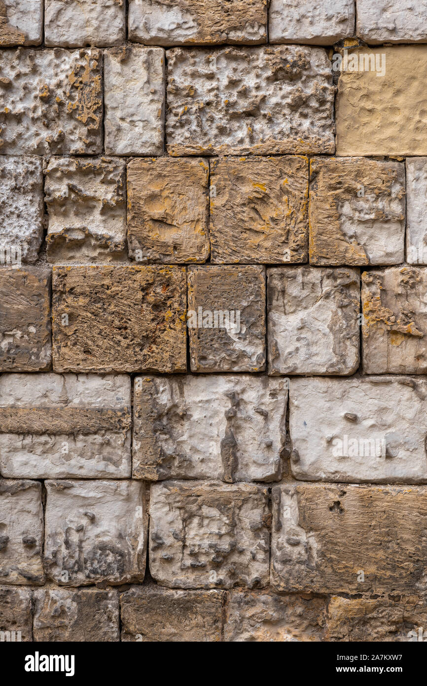 Ancient stone wall background or texture from old city of Mdina in ...