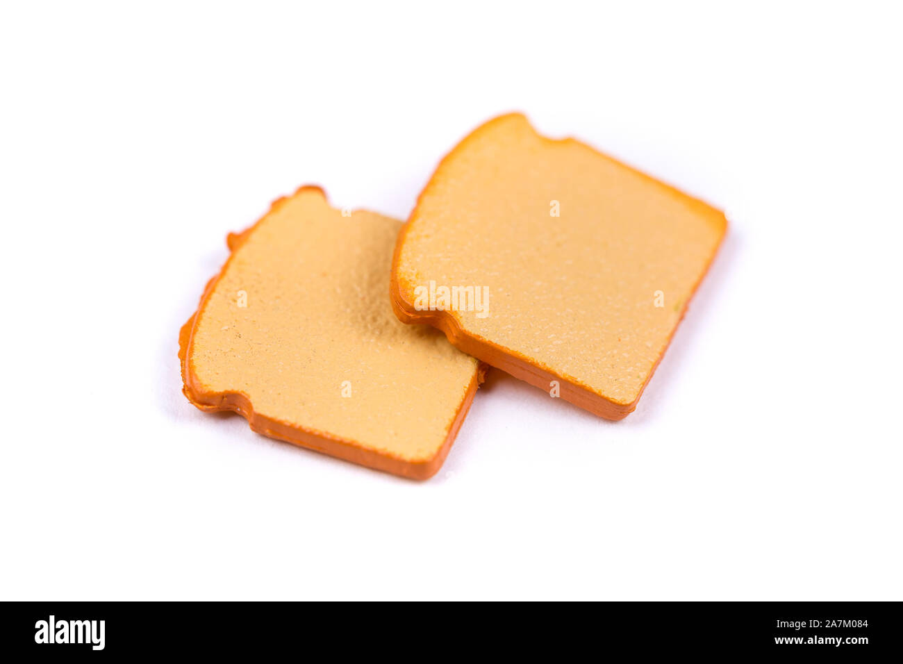 Childs toy plastic food molded 1/6th scale toast Stock Photo - Alamy