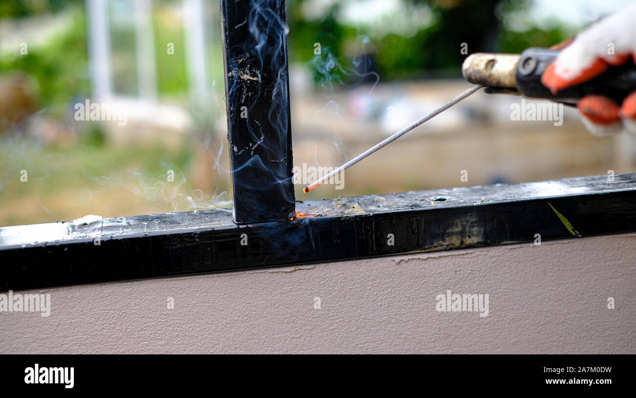 Welder Technician are welding steel with sparks flying Stock Photo - Alamy