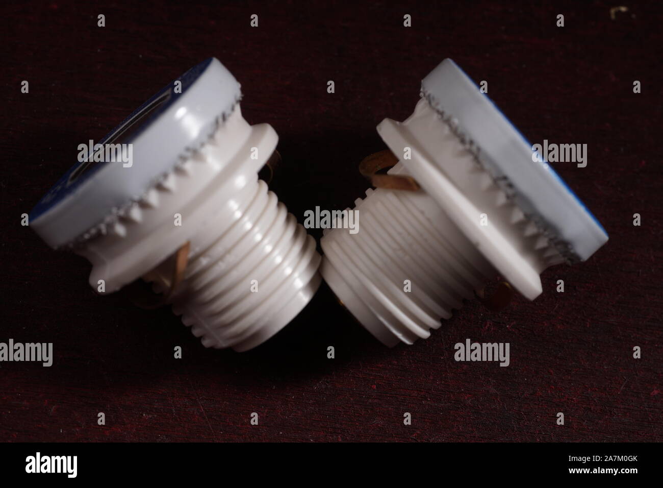 Electrical screw-in fuses on dark red-black background with copy space ...