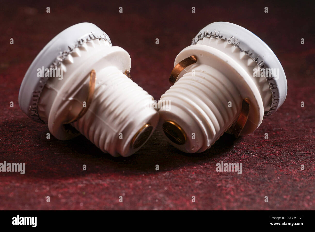 Electrical screw-in fuses on dark red-black background with copy space ...