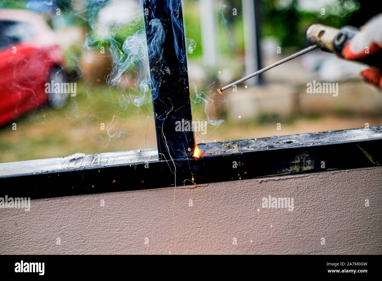 Welder Technician are welding steel with sparks flying Stock Photo - Alamy
