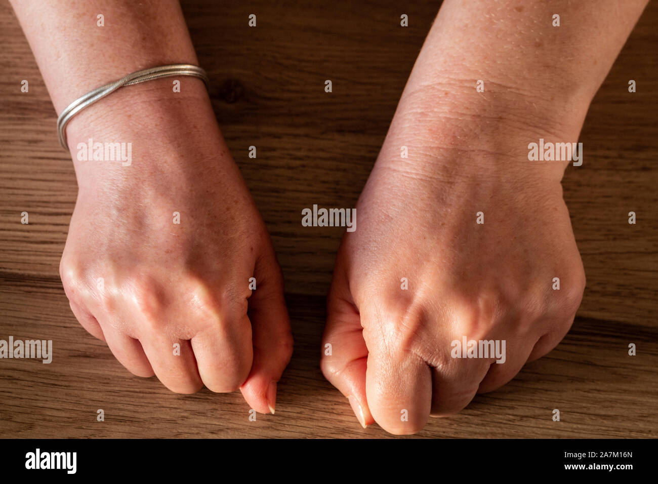 Clenched hands hi-res stock photography and images - Alamy