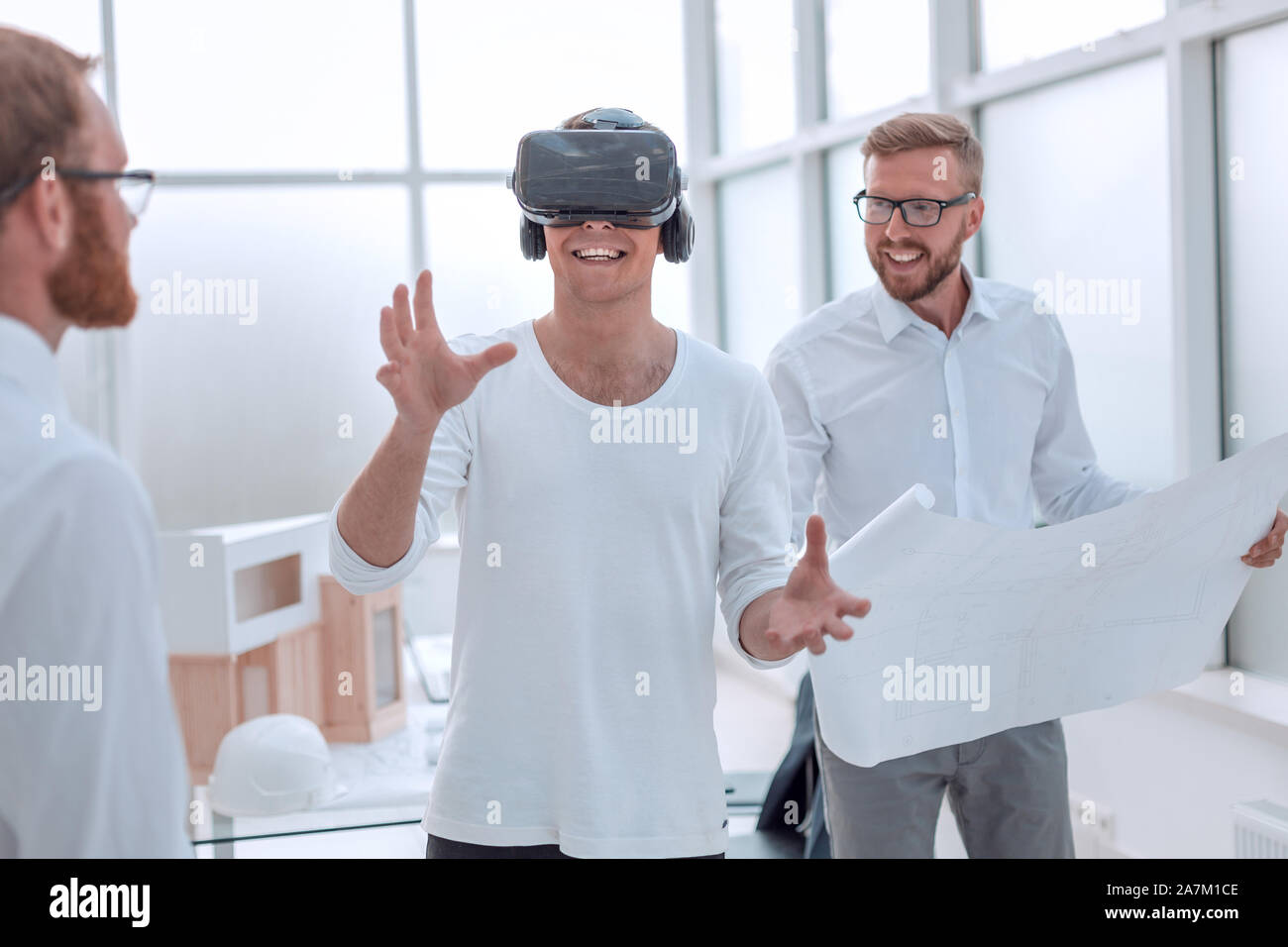 architects and designer using VR helmet in office Stock Photo - Alamy