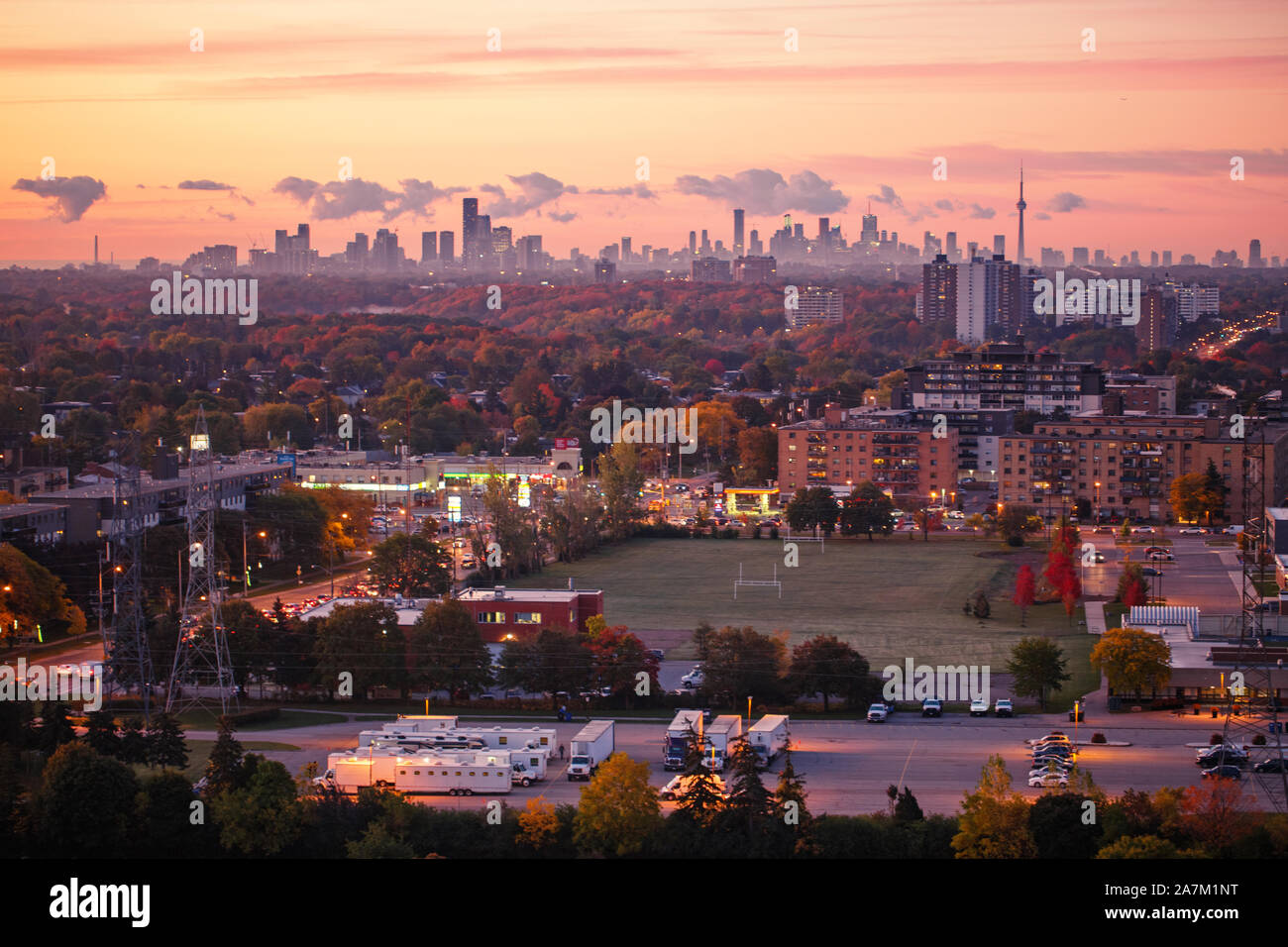Beautiful pink yellow red purple morning sky clouds in Toronto city ...