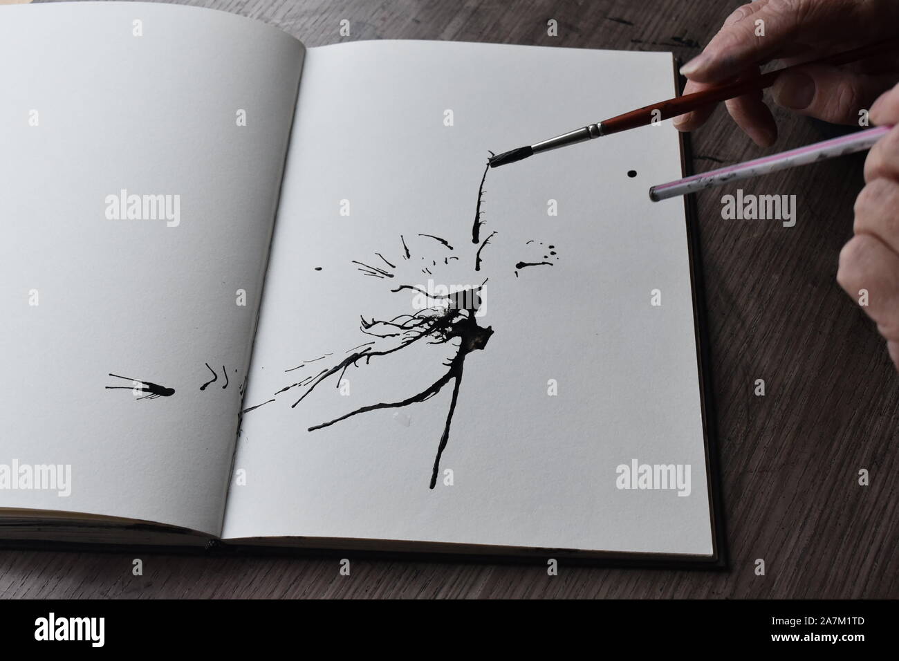 Ink being blown by straw on paper, series of pics in a sequence Stock ...