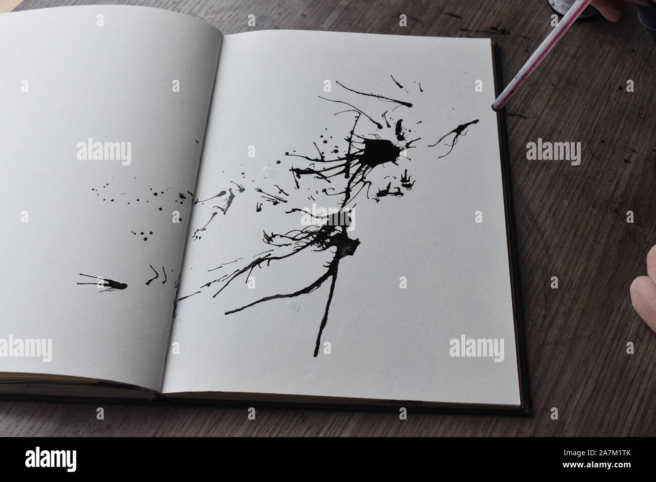 Ink being blown by straw on paper, series of pics in a sequence Stock ...