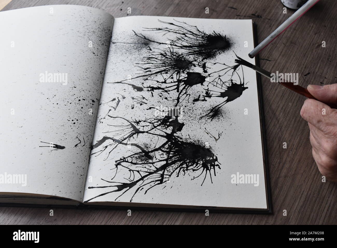 Ink being blown by straw on paper, series of pics in a sequence Stock ...