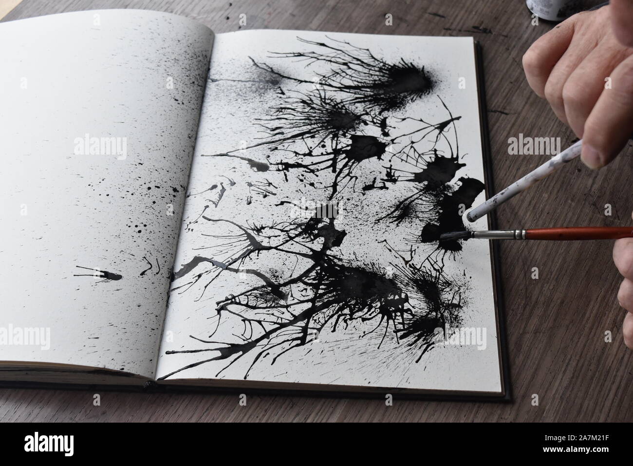Ink being blown by straw on paper, series of pics in a sequence Stock ...