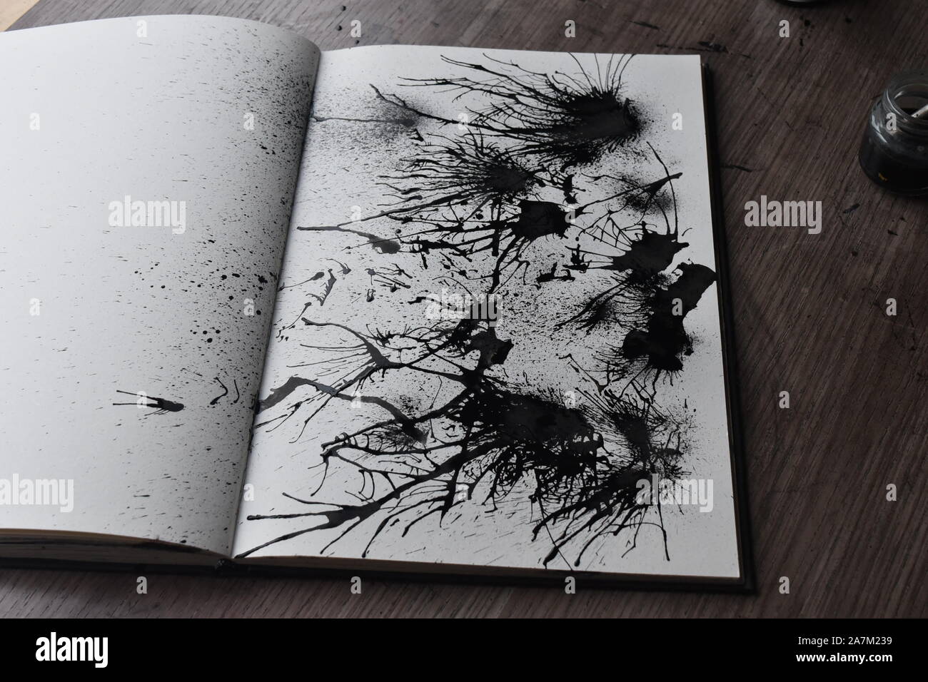 Ink being blown by straw on paper, series of pics in a sequence Stock ...