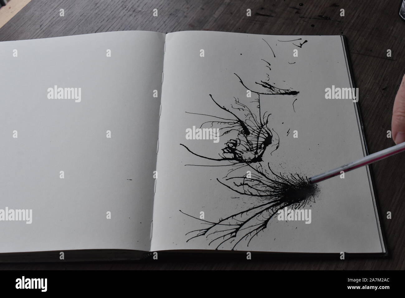 Ink being blown by straw on paper, series of pics in a sequence Stock ...