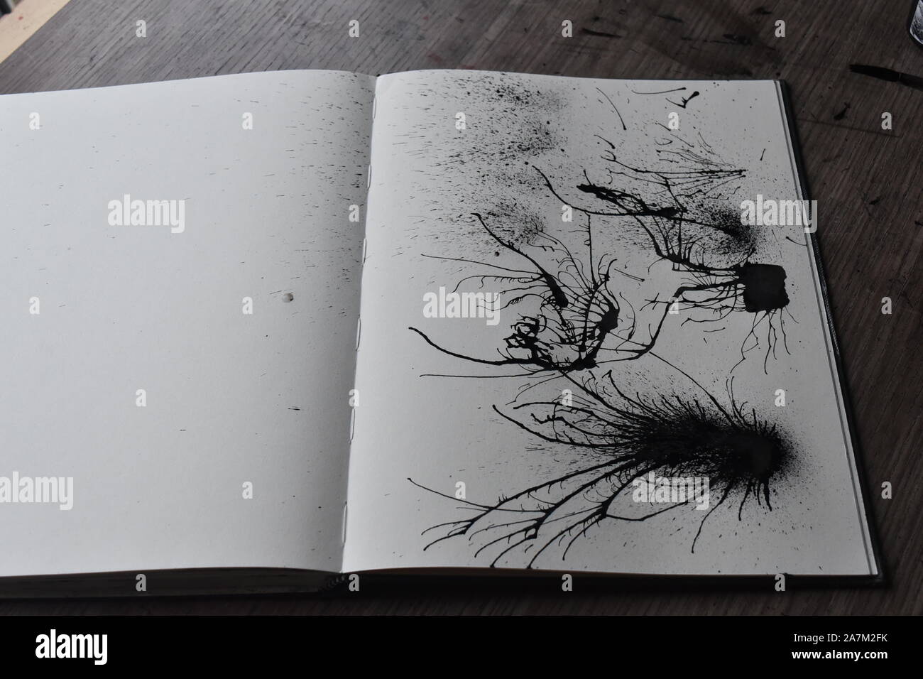 Ink being blown by straw on paper, series of pics in a sequence Stock ...