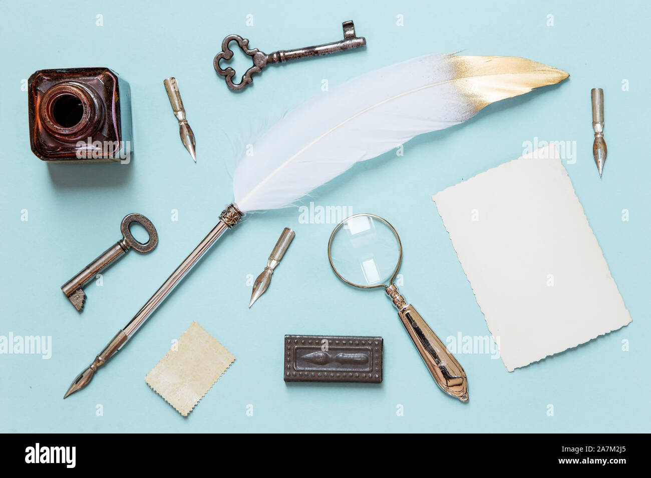 Vintage writing set on blue background Stock Photo - Alamy
