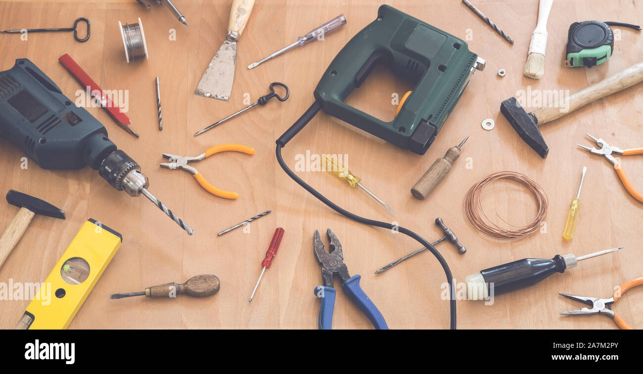 Various tools on wooden background - top view Stock Photo - Alamy