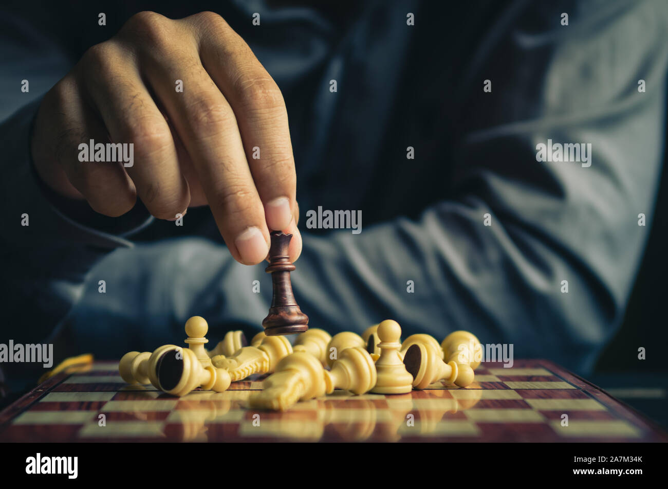 part of human hand moves chess figure on chess board in retro color ...