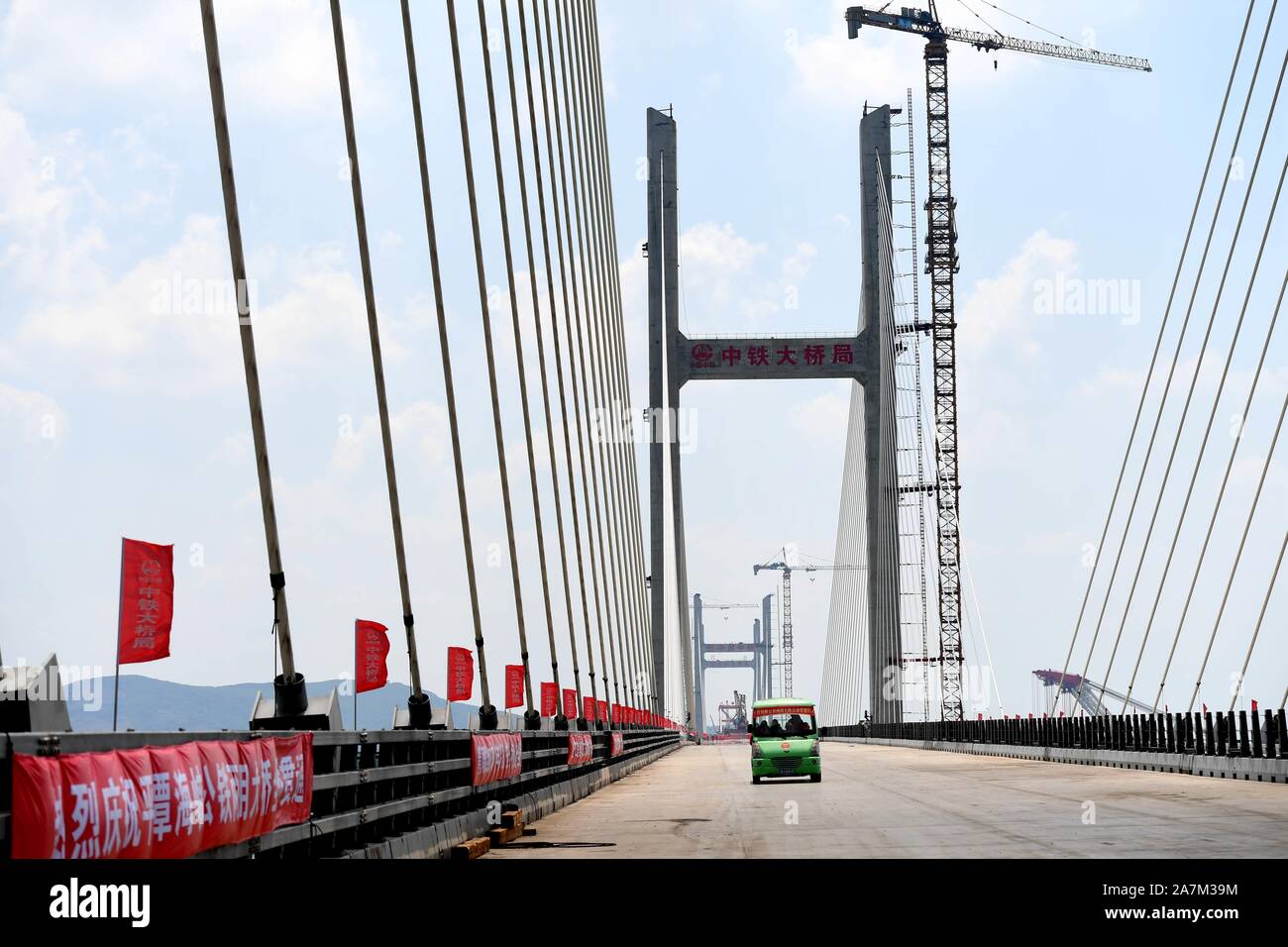 Chinese workers labor at the Pingtan Strait Road-rail Bridge, the world ...