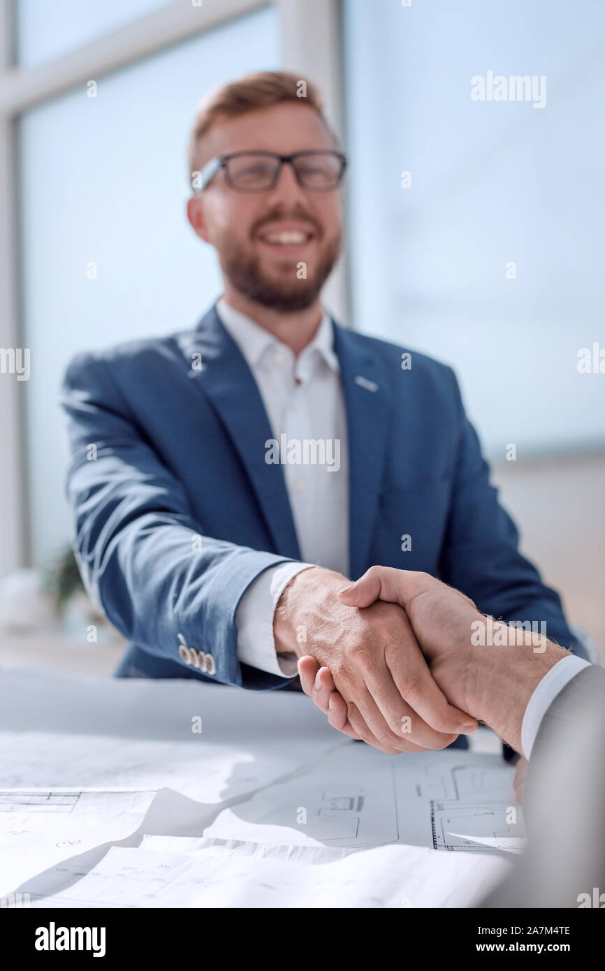close up. business handshake over the Desk Stock Photo - Alamy