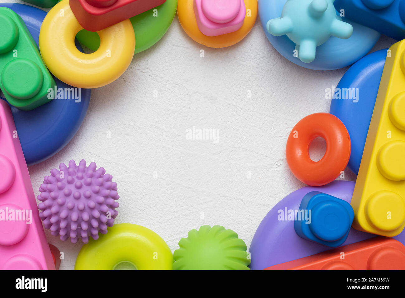 Baby toys flat lay background with copy space Stock Photo - Alamy