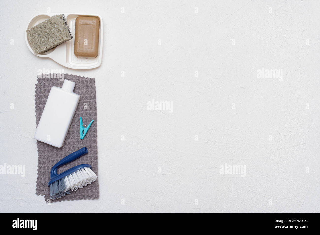 Hand wash concept. Towel, detergent, soap, pin and brush on white ...