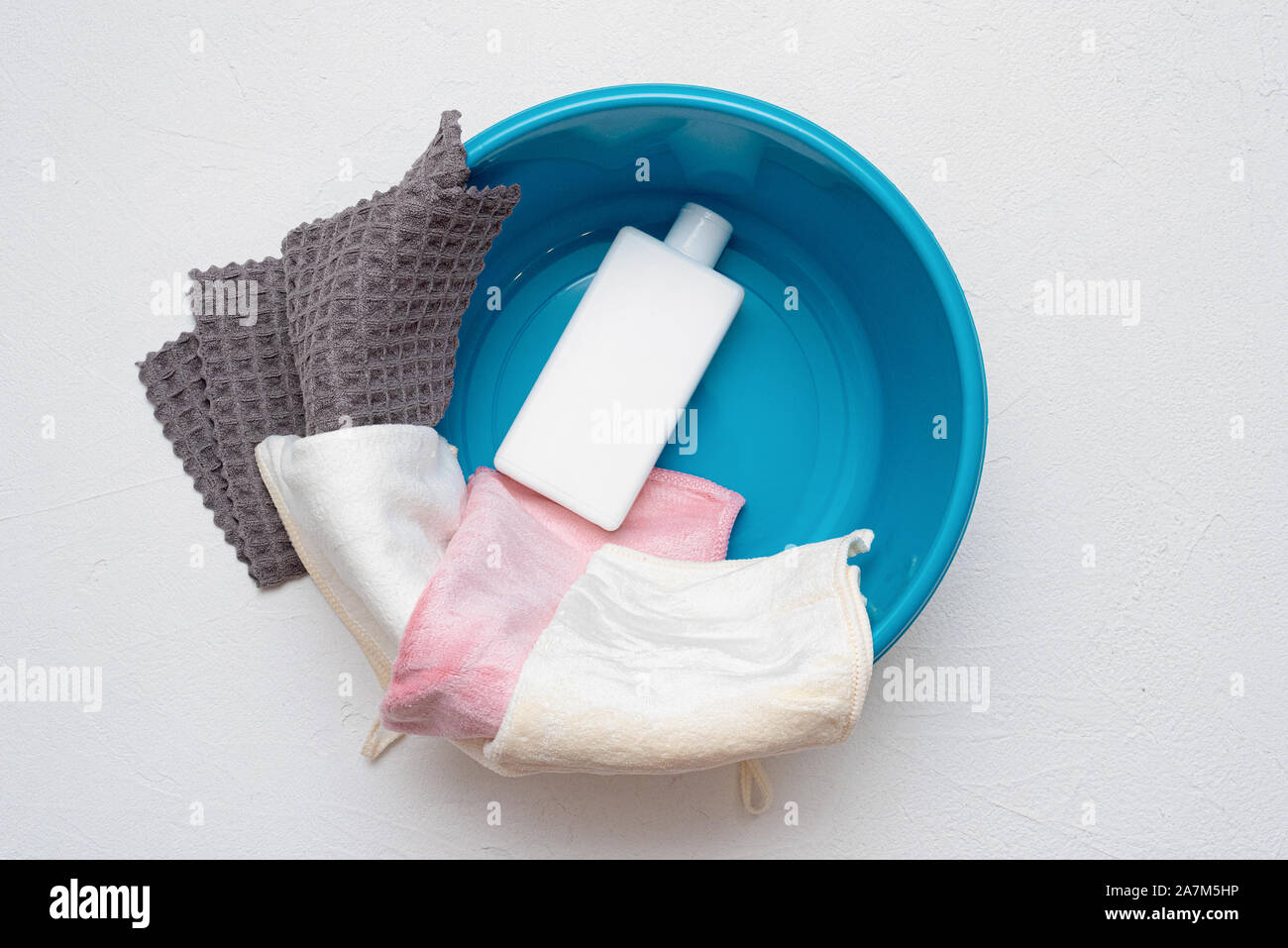 Hand wash concept. Wash basin, towel, detergent, soap, pin and brush on ...