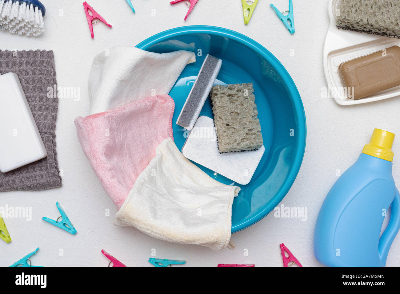 Hand wash concept. Wash basin, towel, detergent, soap, pin and brush on ...