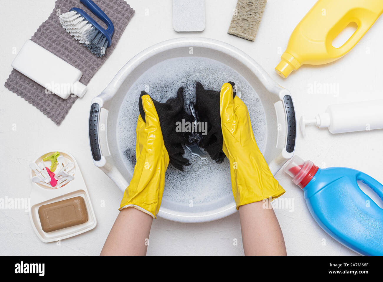 Female hands holding a wash basin with foam water flat lay background ...