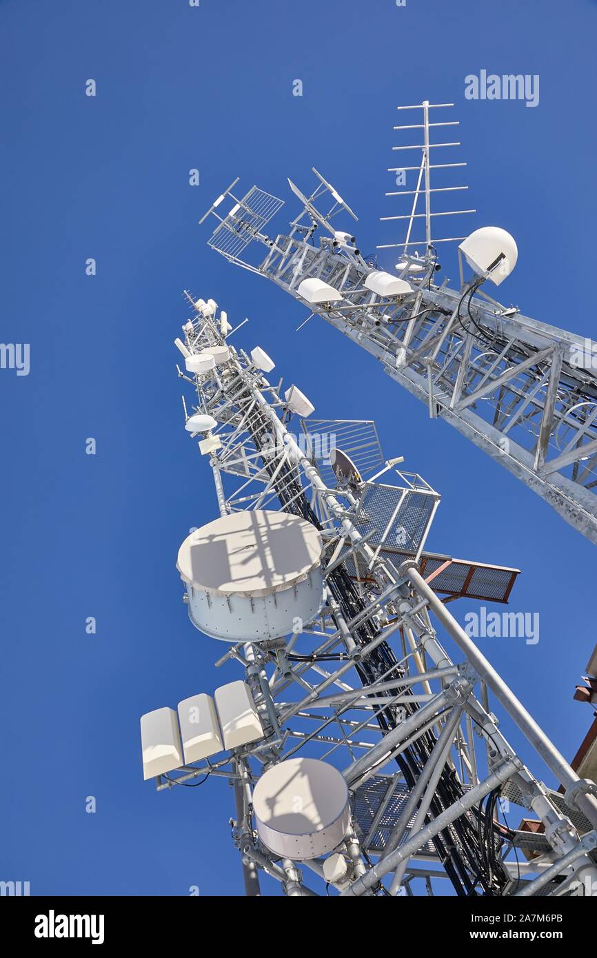 Transmitter towers, blue sky Stock Photo - Alamy