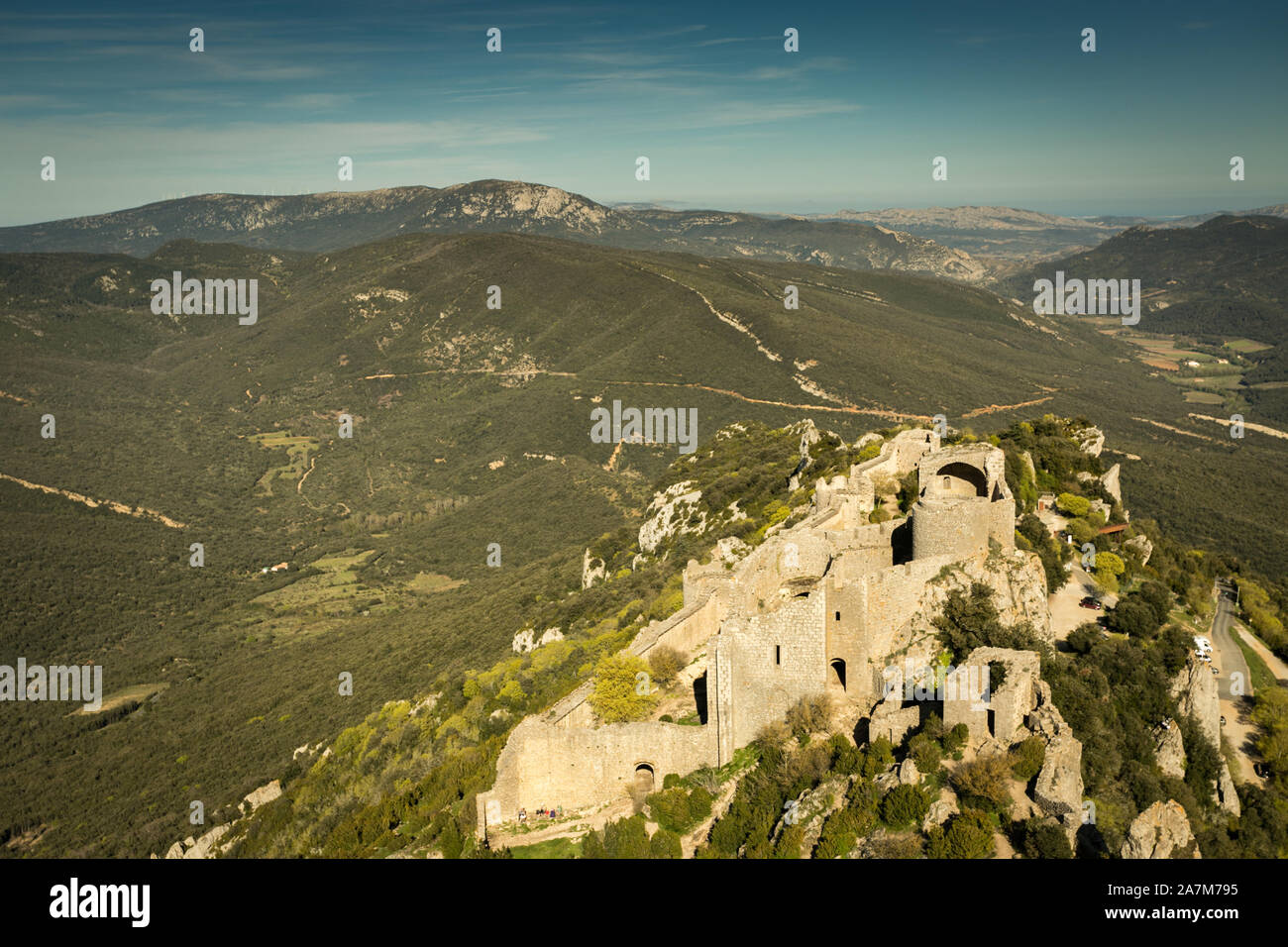 A view across Chateau de Peyrepertuse, with the rolling foothills of ...