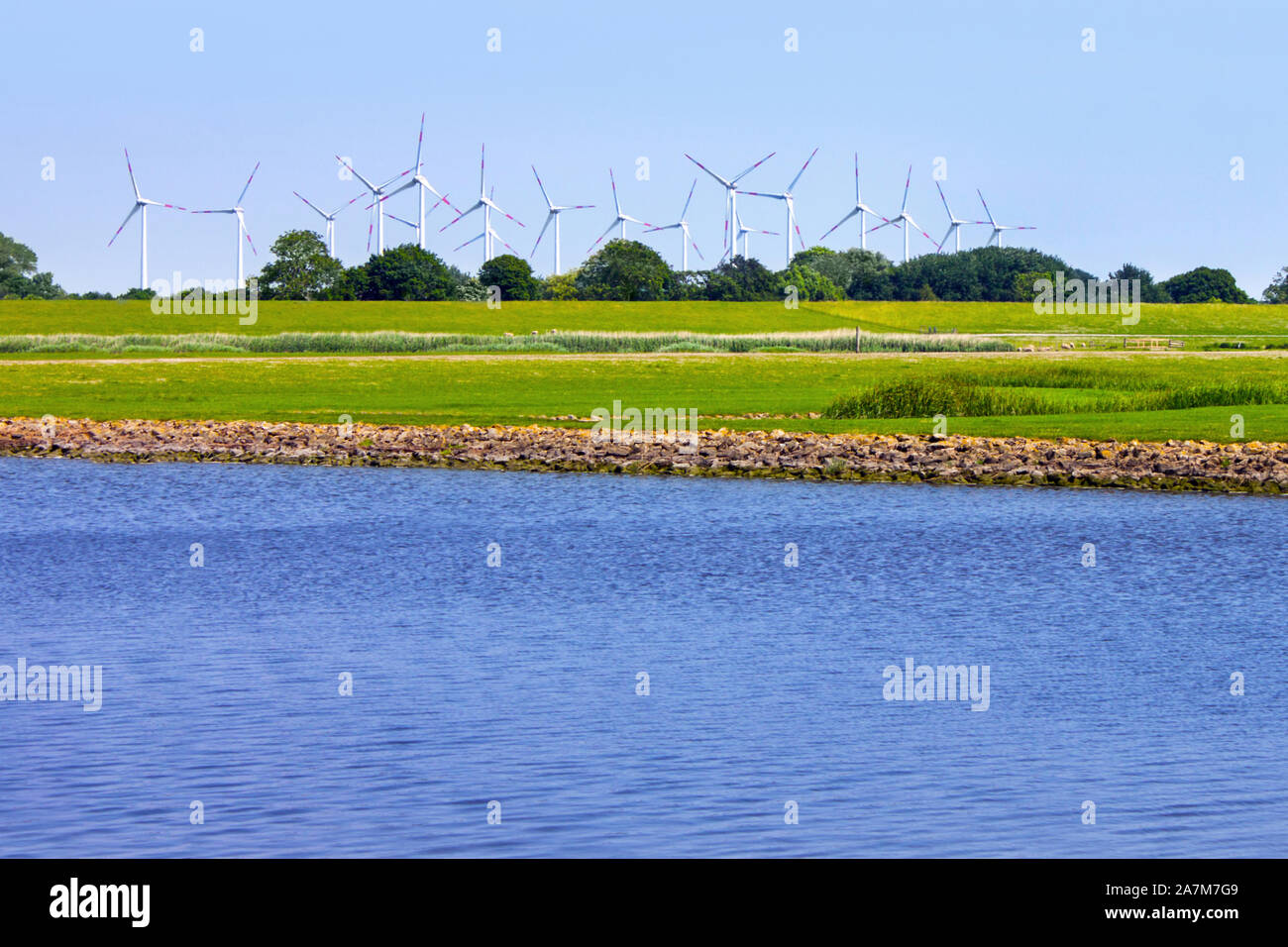 Wind power and nature with lake Stock Photo - Alamy