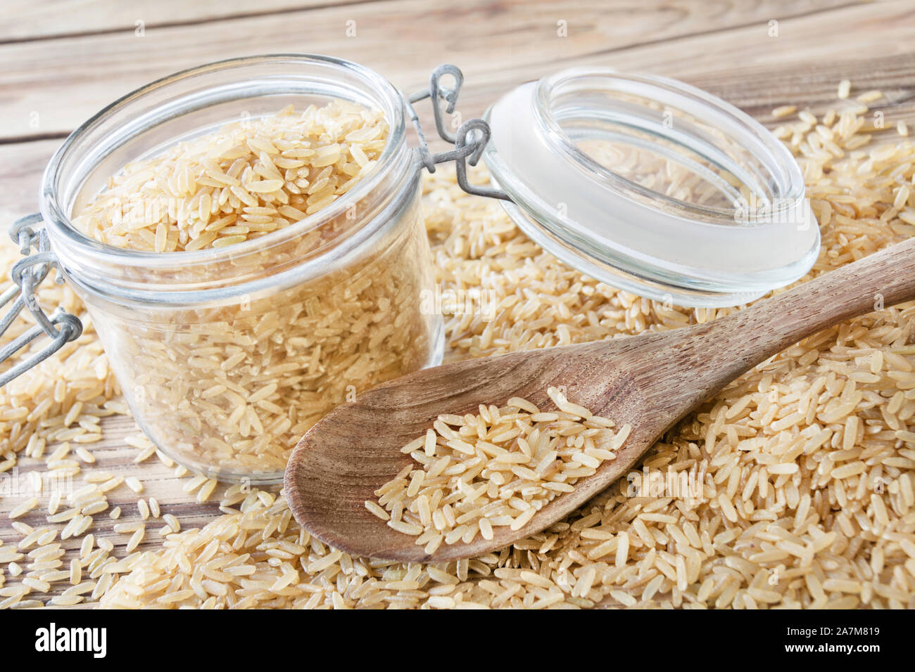 Wholemeal rice in glass as background Stock Photo - Alamy