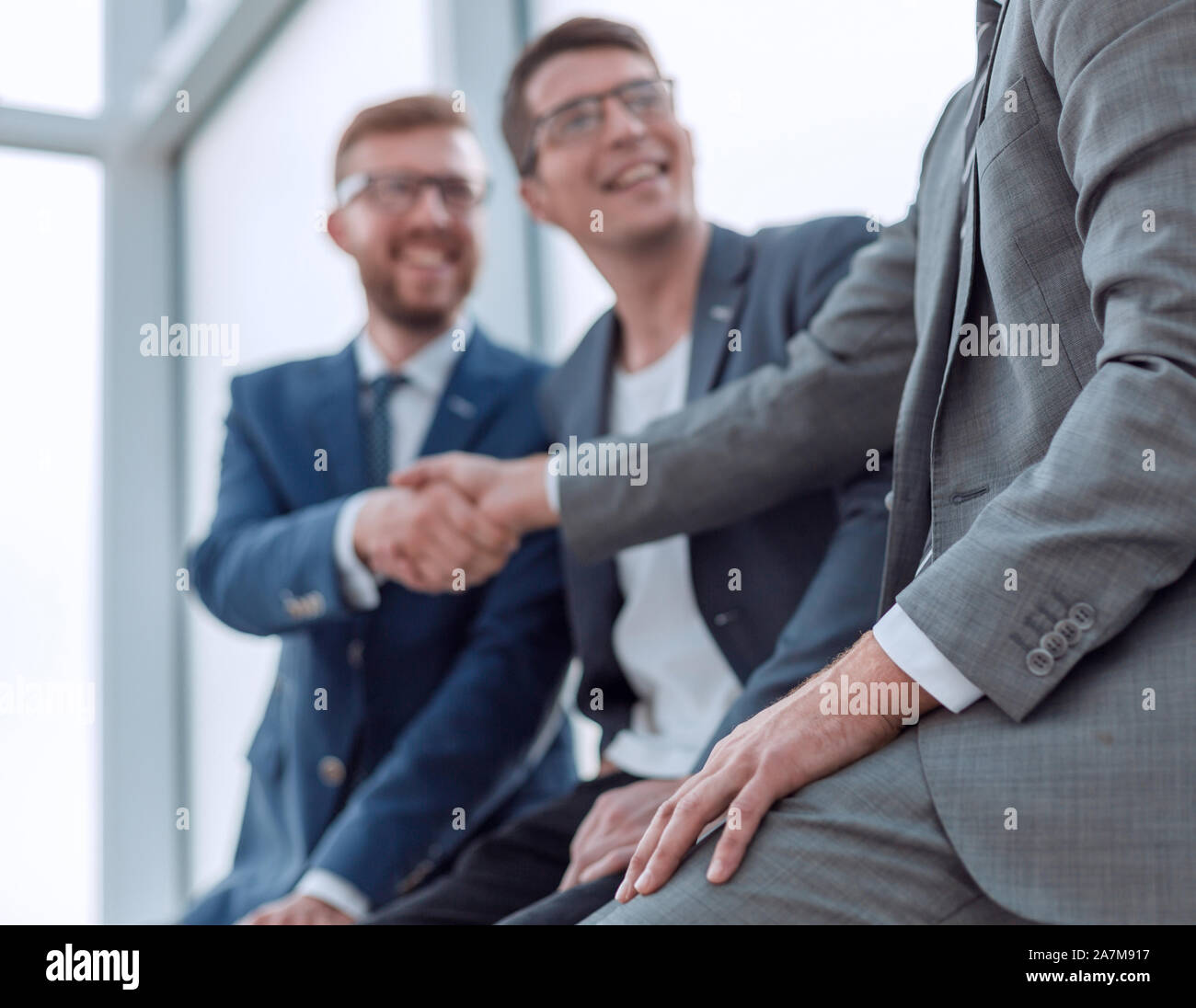 close up. background image of a business handshake in the office lobby ...