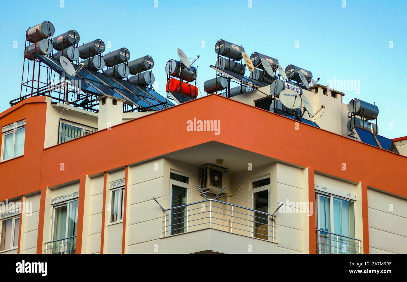 Solar panels and water tanks on roof, Antalya, Konyaalti, Turkish ...