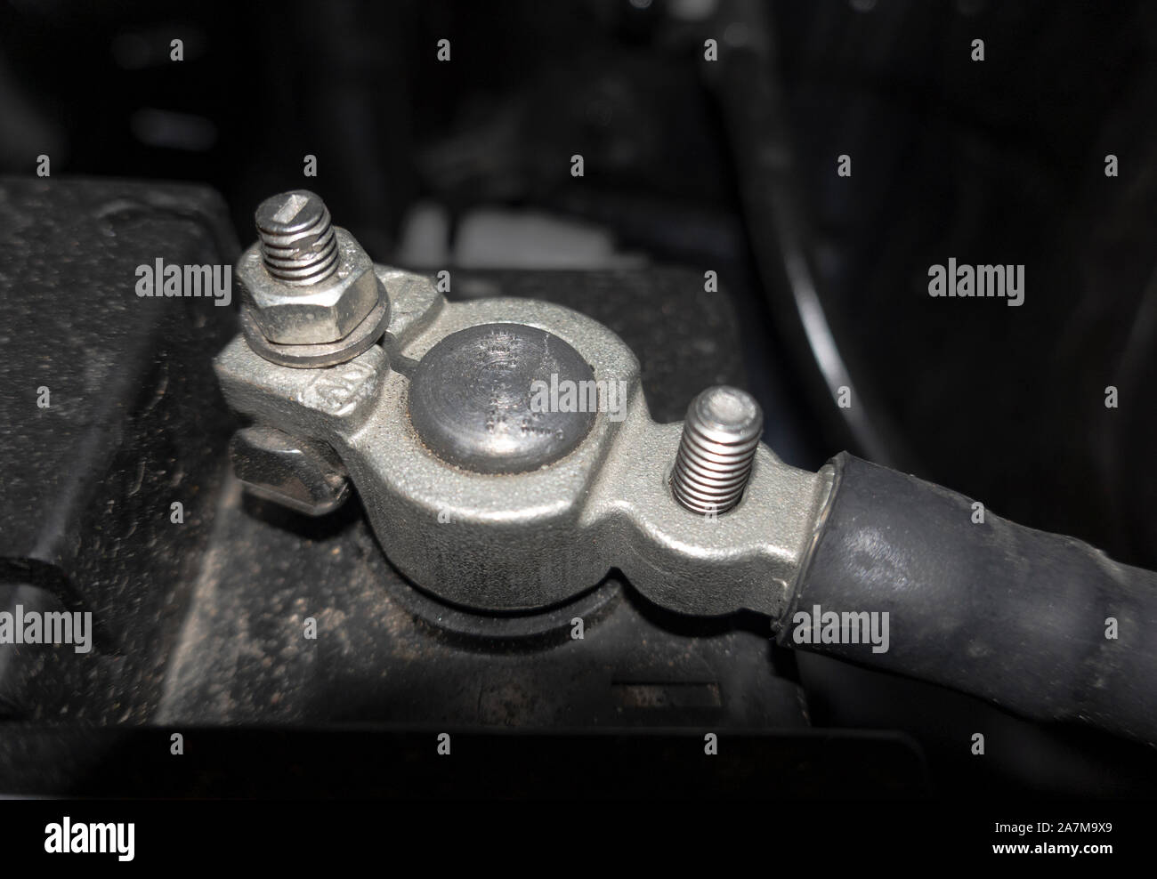 A terminal bolted to a car battery close-up Stock Photo - Alamy