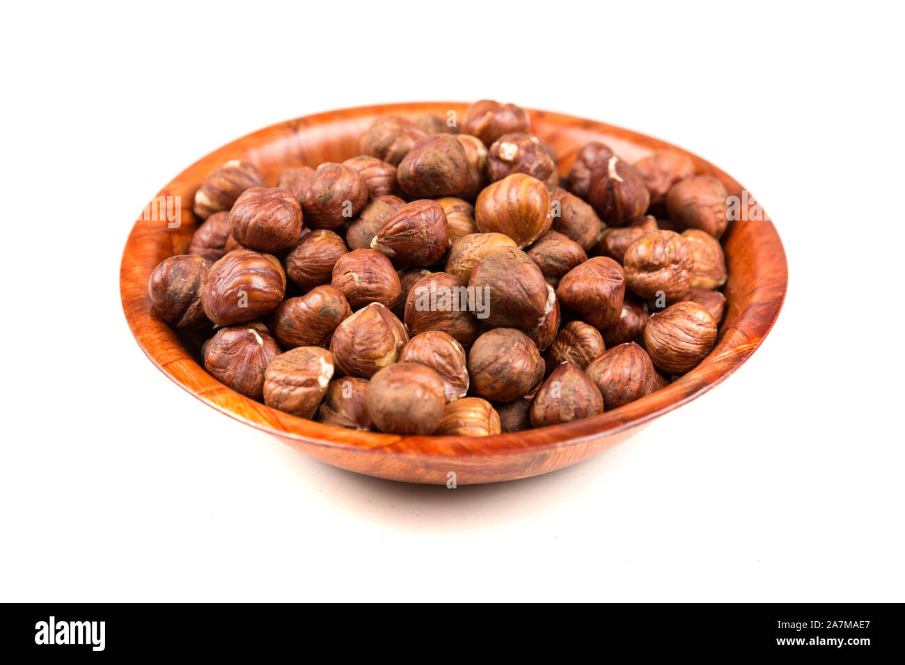 Pile of whole unshelled hazelnuts isolated Stock Photo - Alamy