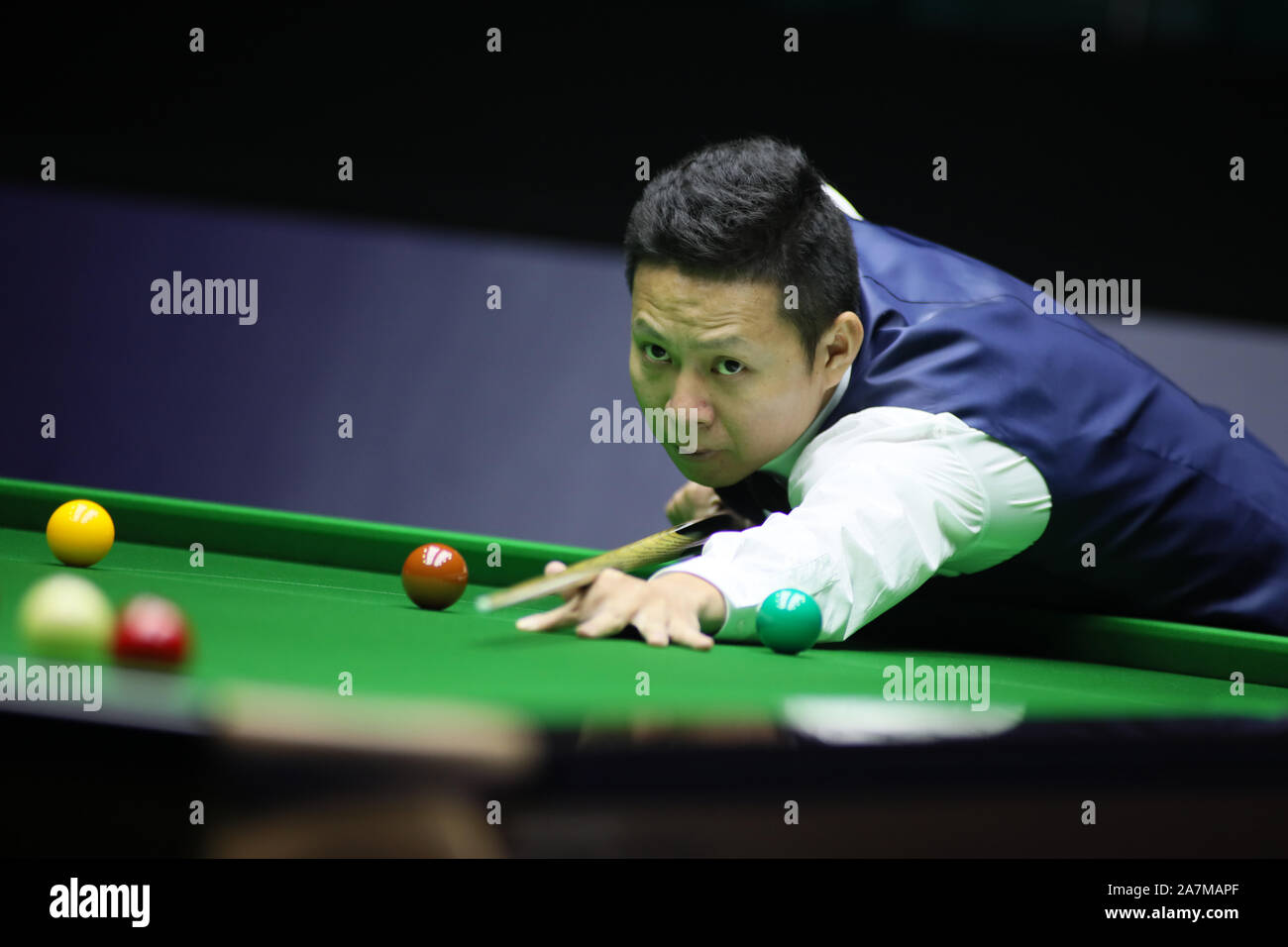 Mei Xiwen of China plays a shot to Yan Bingtao of China at 2019 China ...