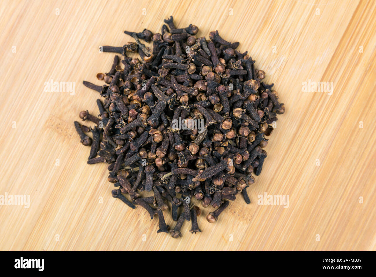 Whole clove heads and pieces isolated over white Stock Photo - Alamy