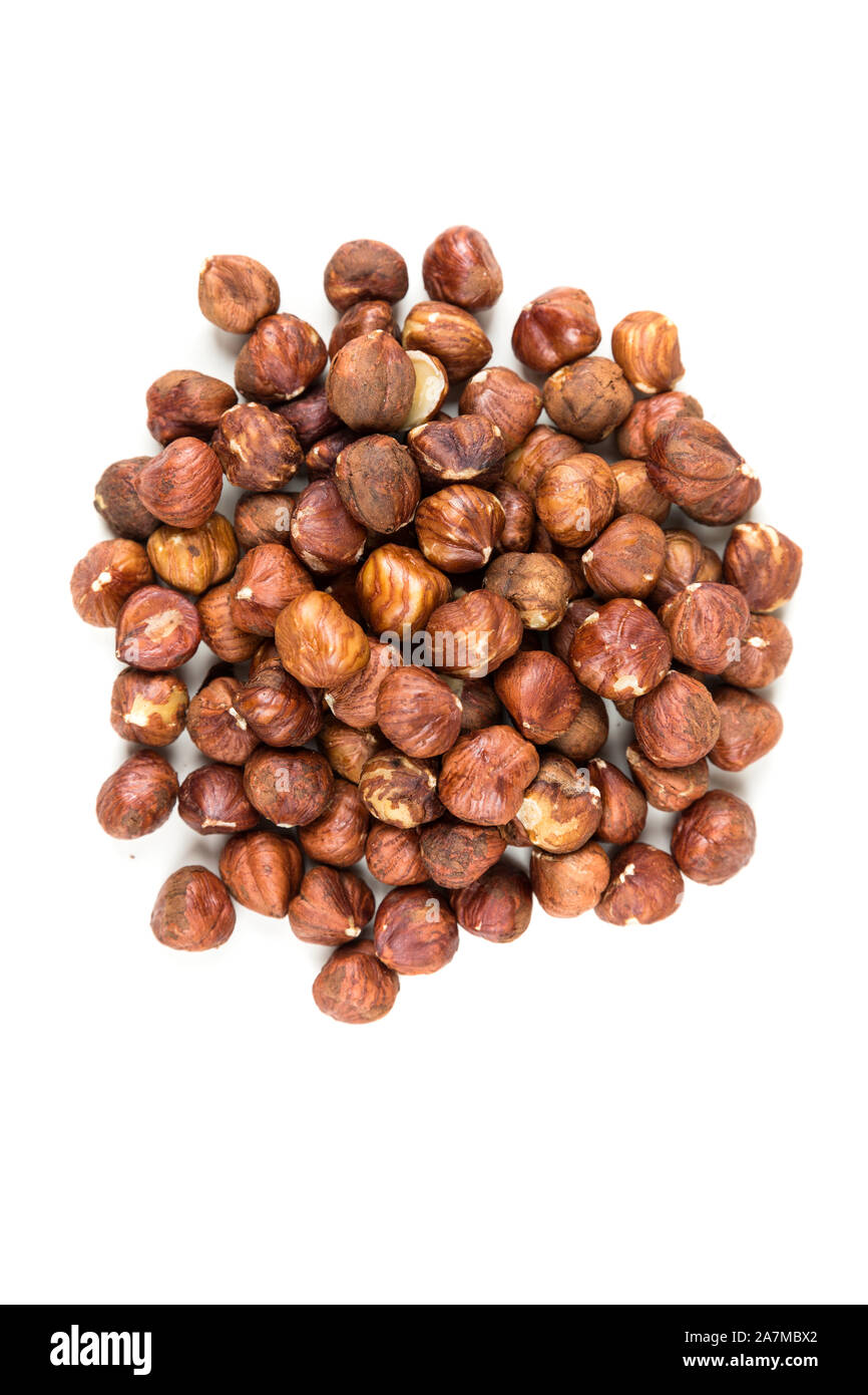 Pile of whole unshelled hazelnuts isolated Stock Photo - Alamy