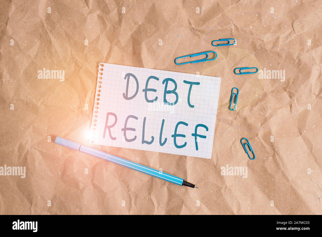 Writing note showing Debt Relief. Business concept for a reduction in ...