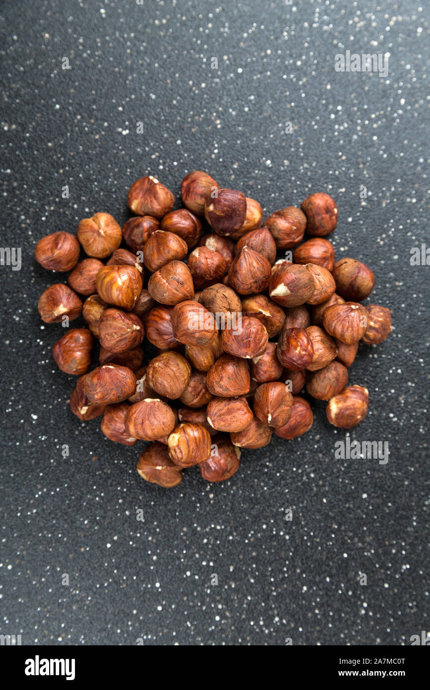 Pile of whole unshelled hazelnuts isolated Stock Photo - Alamy