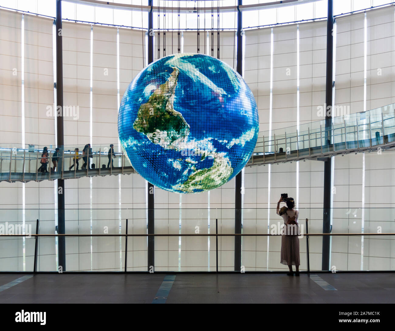 Tokyo, Japan - 12 Oct 2018: A woman is taking a picture of Geo-Cosmos ...
