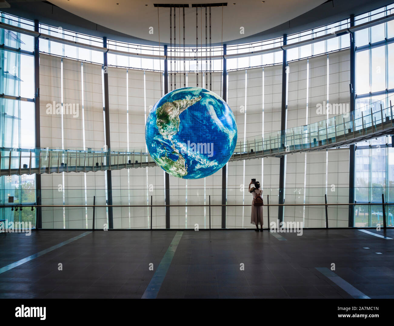 Tokyo, Japan - 12 Oct 2018: A woman is taking a picture of Geo-Cosmos ...