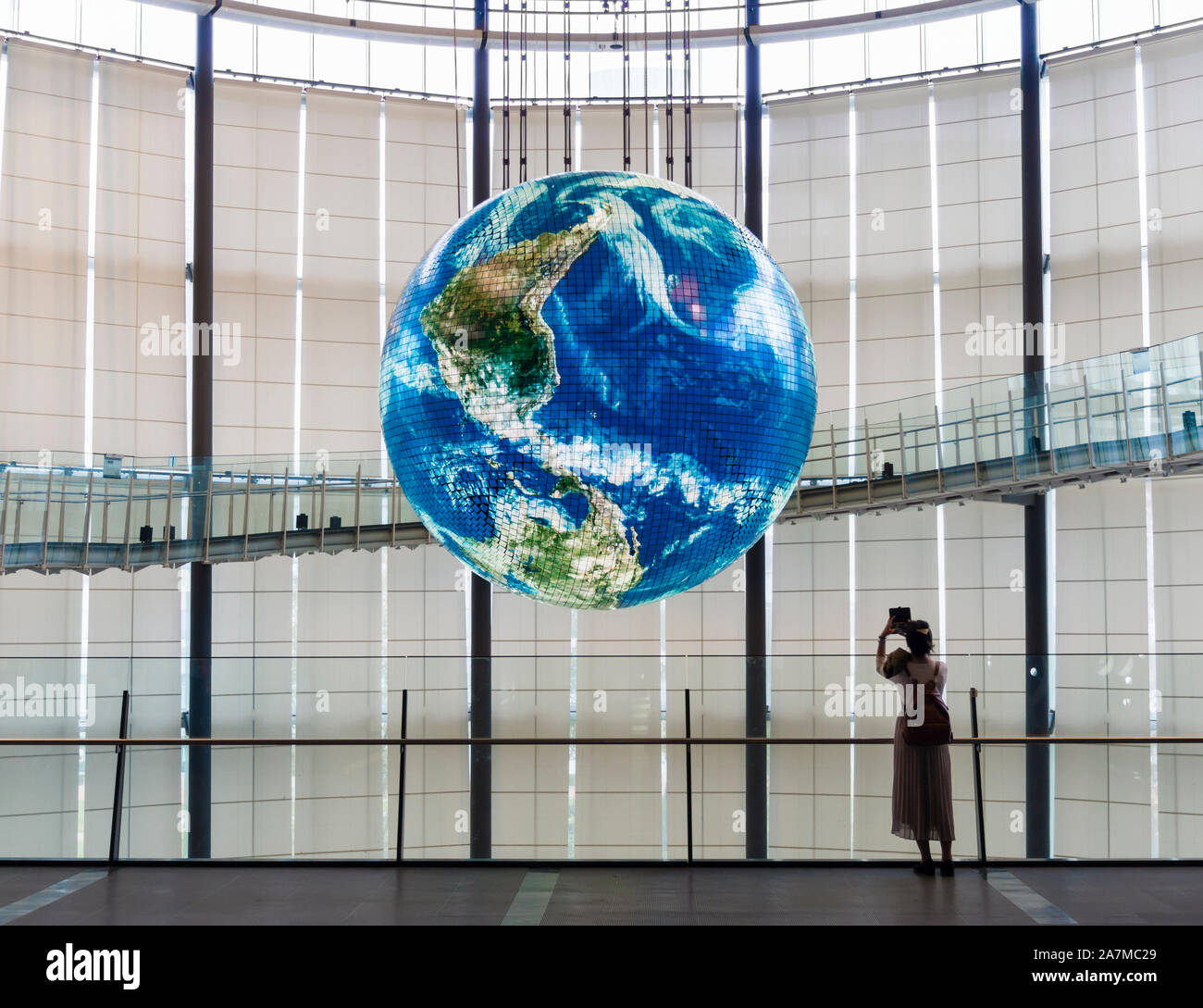 Tokyo, Japan - 12 Oct 2018: A woman is taking a picture of Geo-Cosmos ...