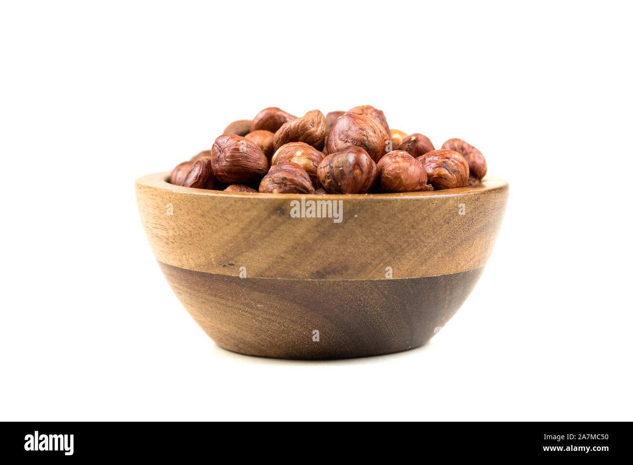 Pile of whole unshelled hazelnuts isolated Stock Photo - Alamy