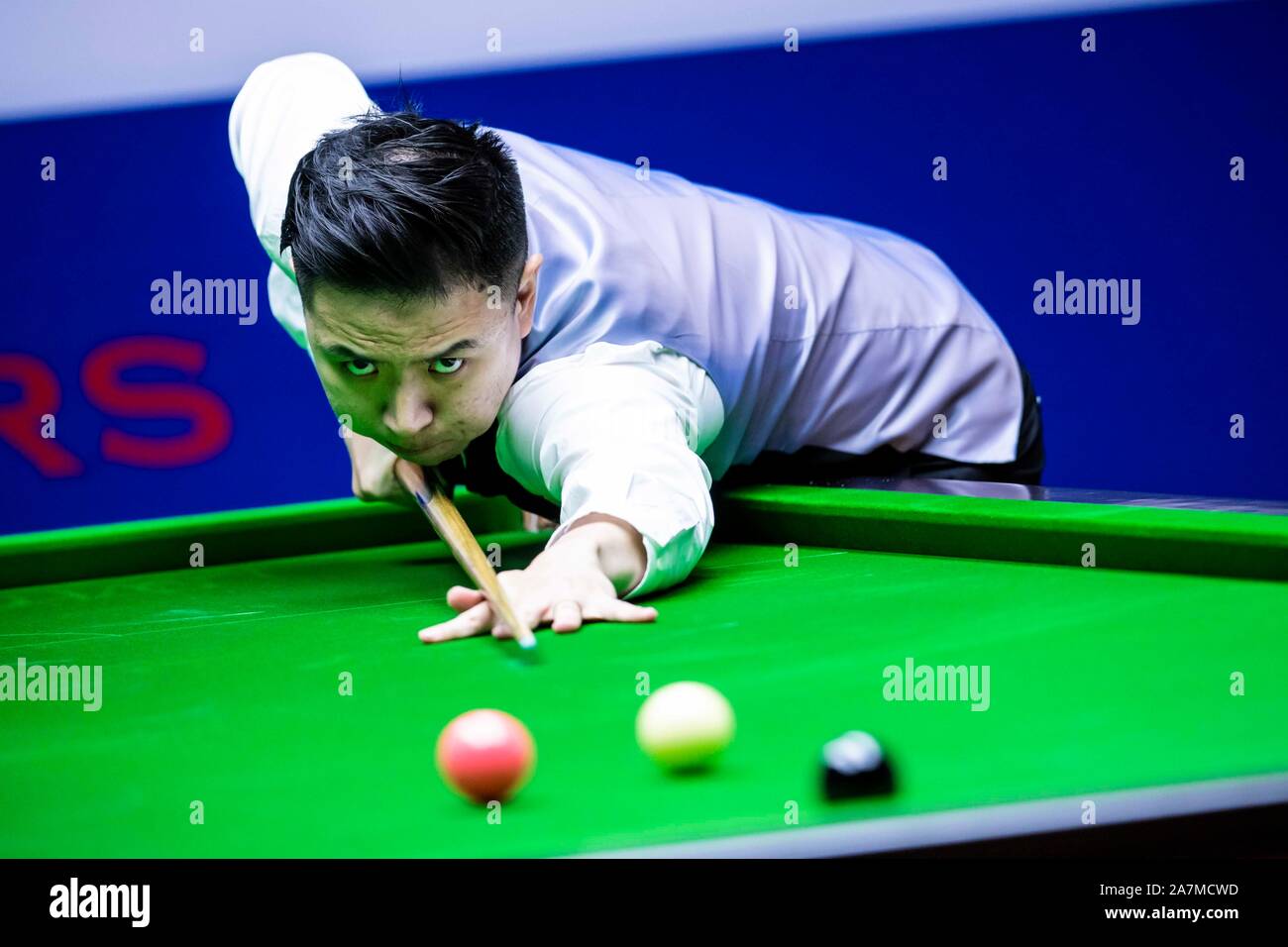 Chinese professional snooker player Xiao Guodong plays a shot at the ...