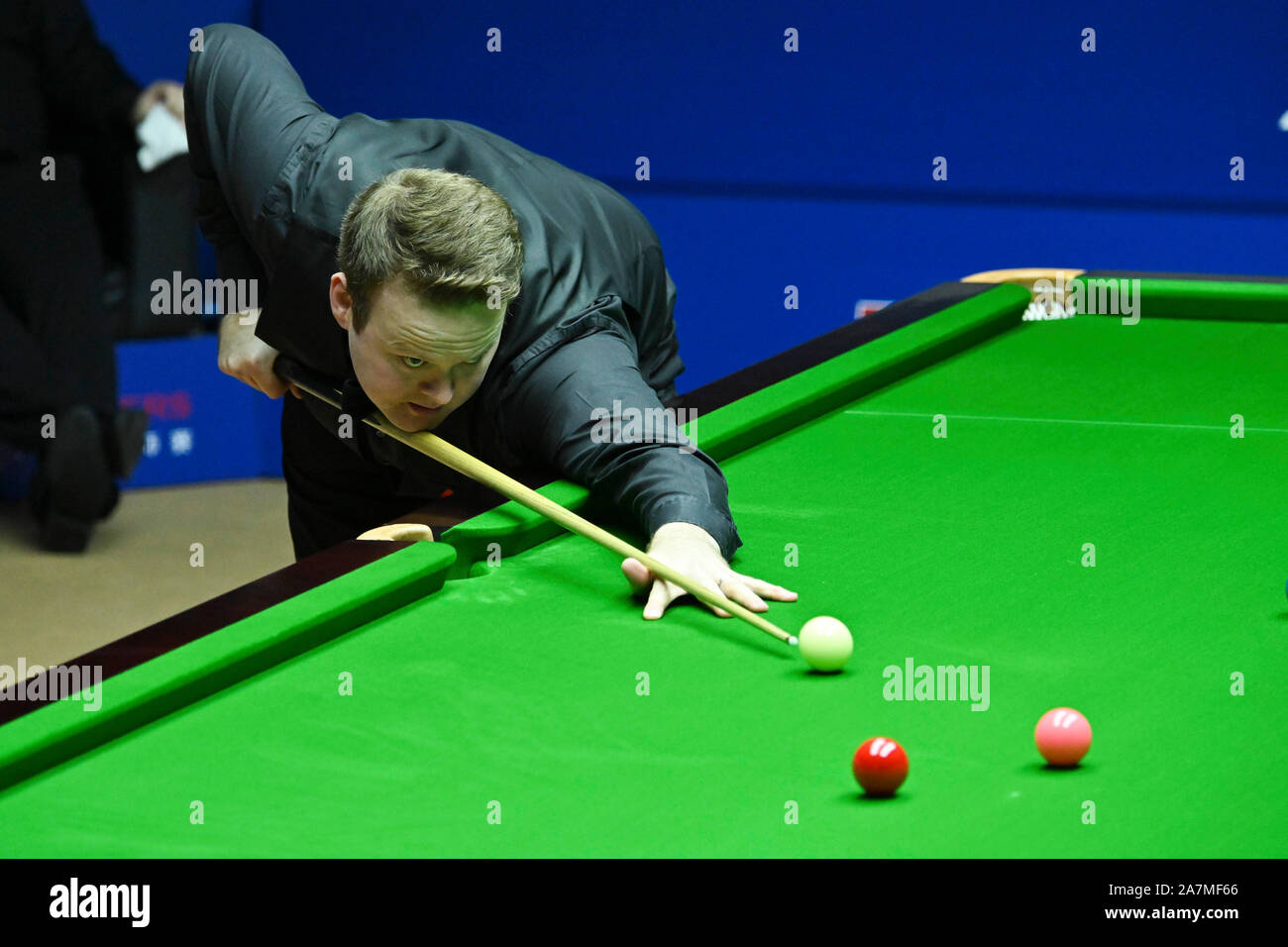 Shaun Murphy of England plays a shot to Mark Allen of Northern Ireland ...