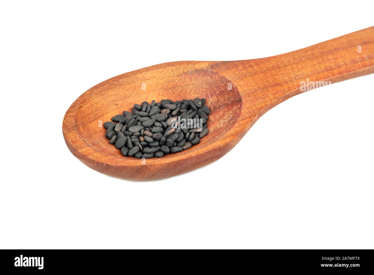 Wooden spoon with black sesame seeds closeup on white background Stock ...
