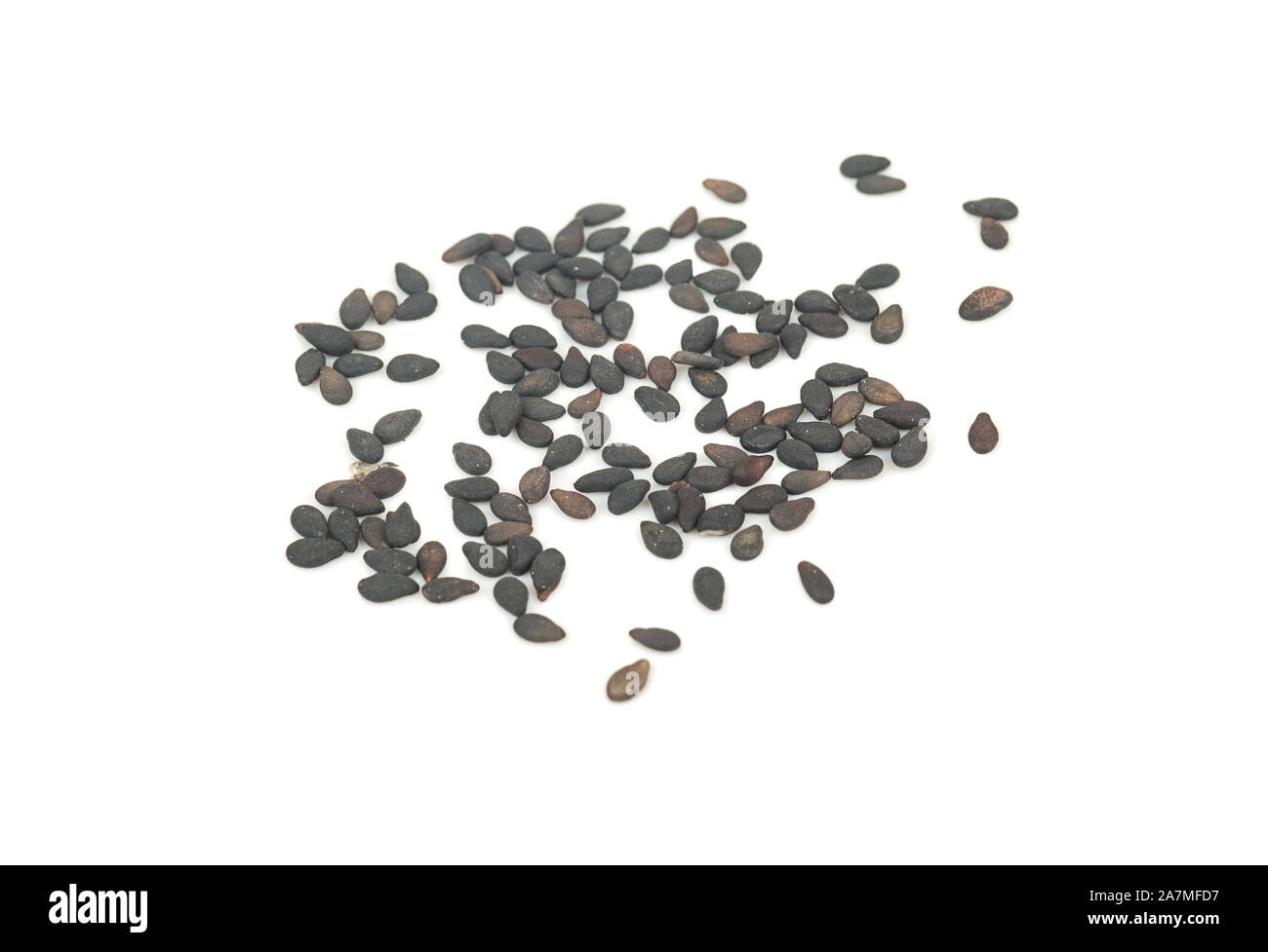 Scattered black sesame seeds on white background Stock Photo - Alamy
