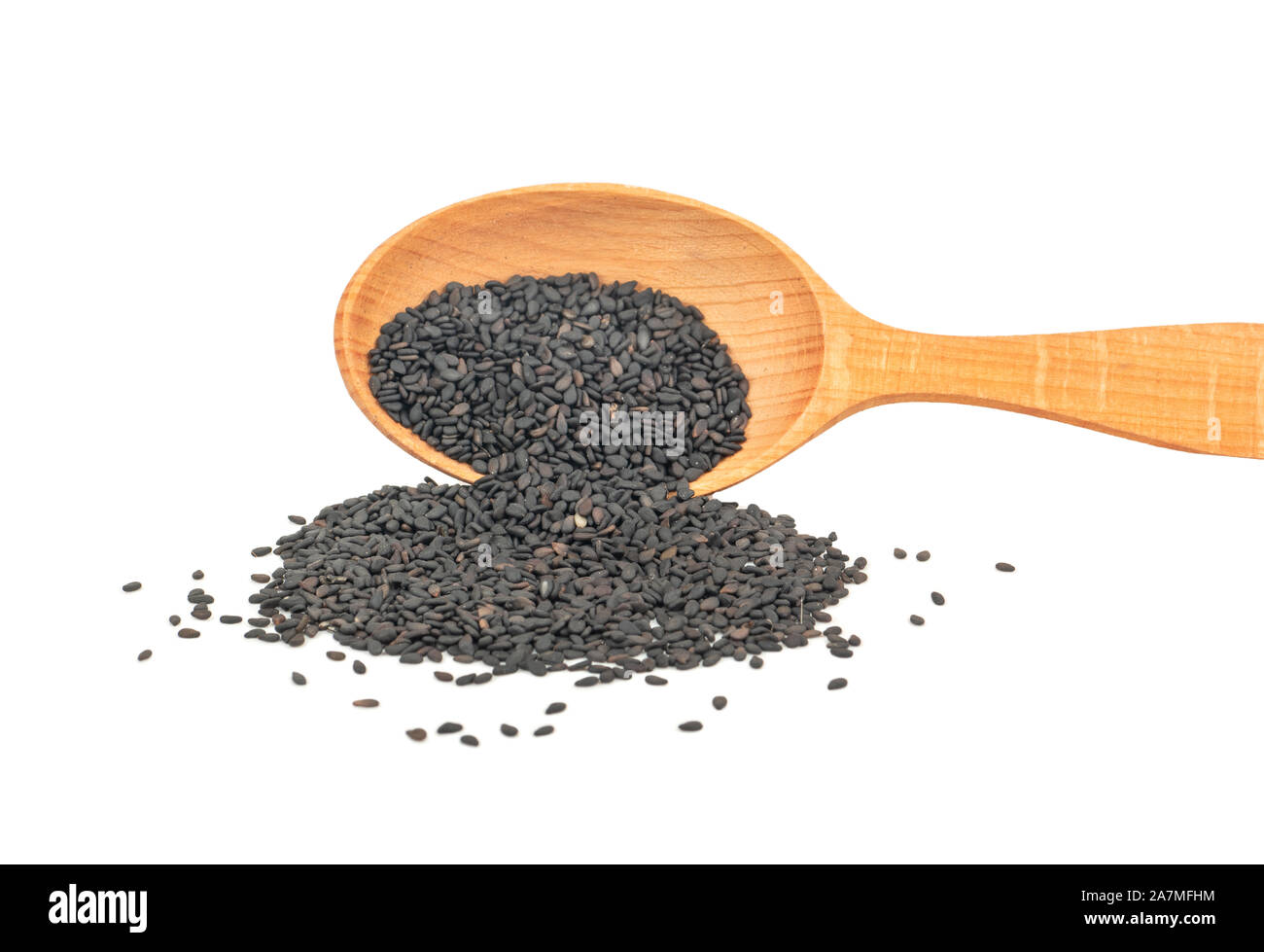 Scattered black sesame seeds with a spoon on a white background Stock ...