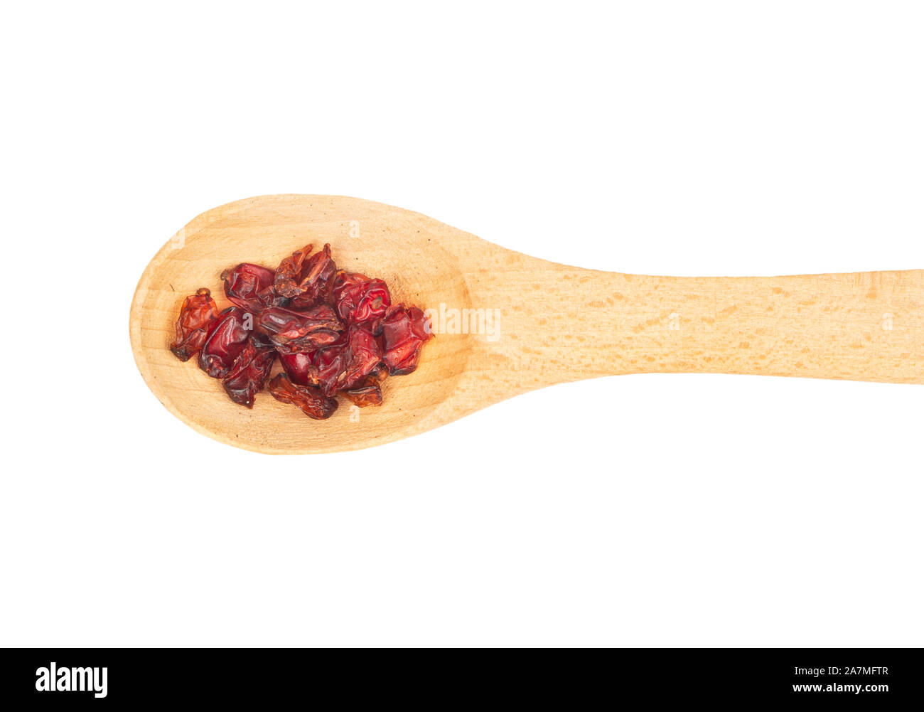 Dry barberry in a small wooden spoon isolated on white background ...