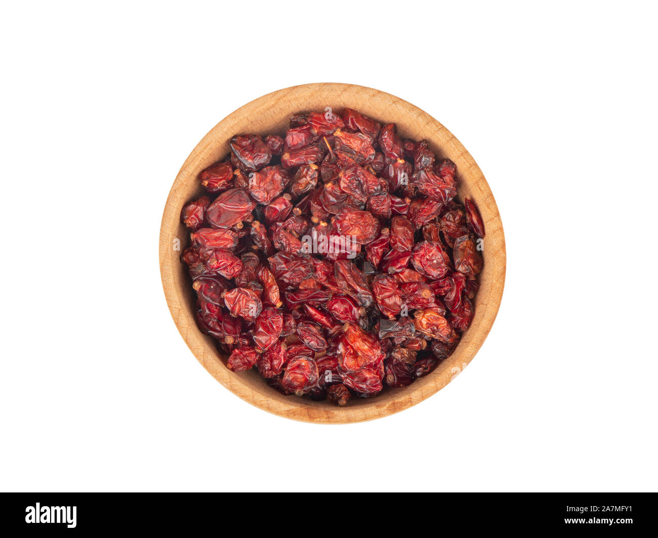 Dry barberry in wooden bowl on white background, top view Stock Photo ...